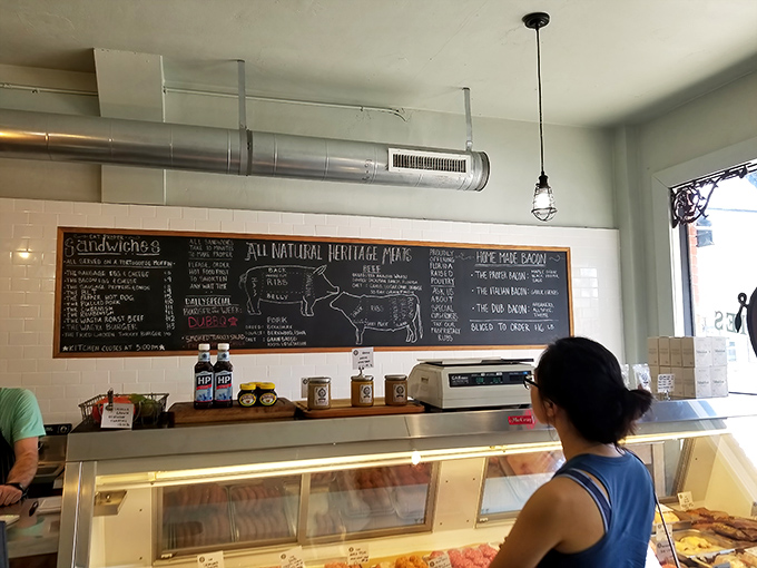 The chalkboard diagram of heritage pork cuts serves as both education and temptation&mdash;meat geography lessons never tasted so good.