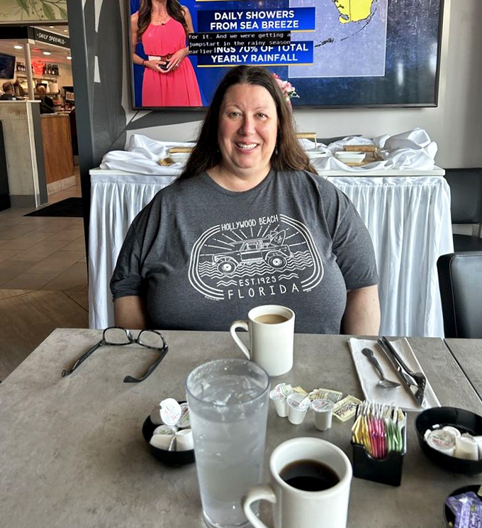 Coffee steam rising like morning fog as patrons settle in for the ritual of good food and better conversation.