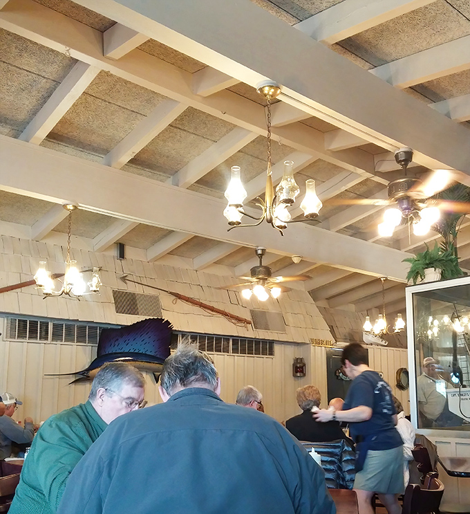 Where locals gather under vintage lighting fixtures to share stories and seafood &ndash; the true recipe for community.