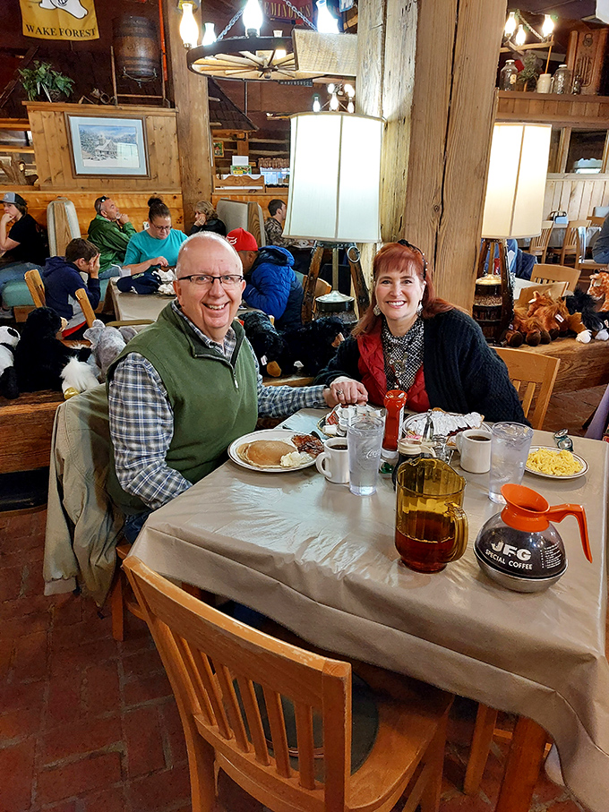 Happy diners with that unmistakable "we've made an excellent breakfast decision" glow. The coffee pot stands ready for inevitable refills.
