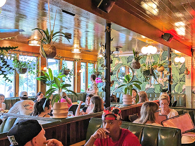 The true measure of a restaurant's success? A diverse crowd of happy diners surrounded by enough plants to qualify as a botanical garden.