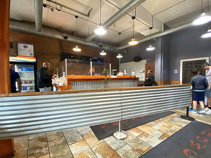 The ordering counter where barbecue dreams come true. That corrugated metal isn't just decor&mdash;it's a signal that serious smoking happens here.