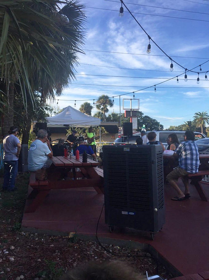 String lights overhead, palm trees swaying, and picnic tables filled with folks who've discovered the secret to happiness is often served on a paper plate.