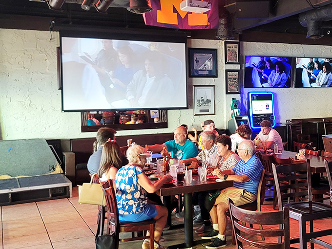 Where locals gather to cheer, jeer, and occasionally raise a glass to whatever's happening on that massive projection screen.