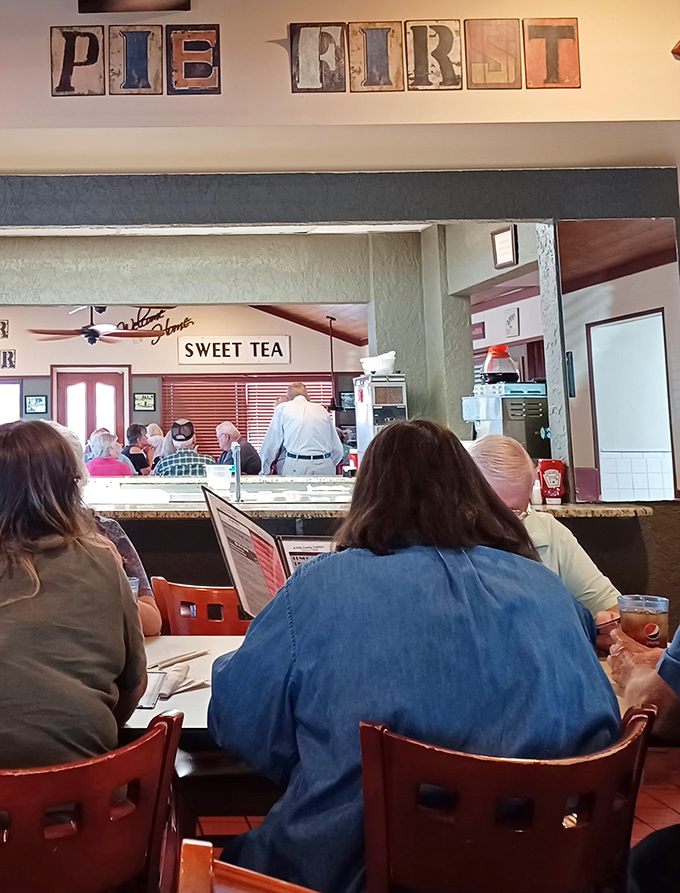 The "PIE FIRST" philosophy in action&mdash;diners contemplating which slice will change their lives today. Decisions, decisions.