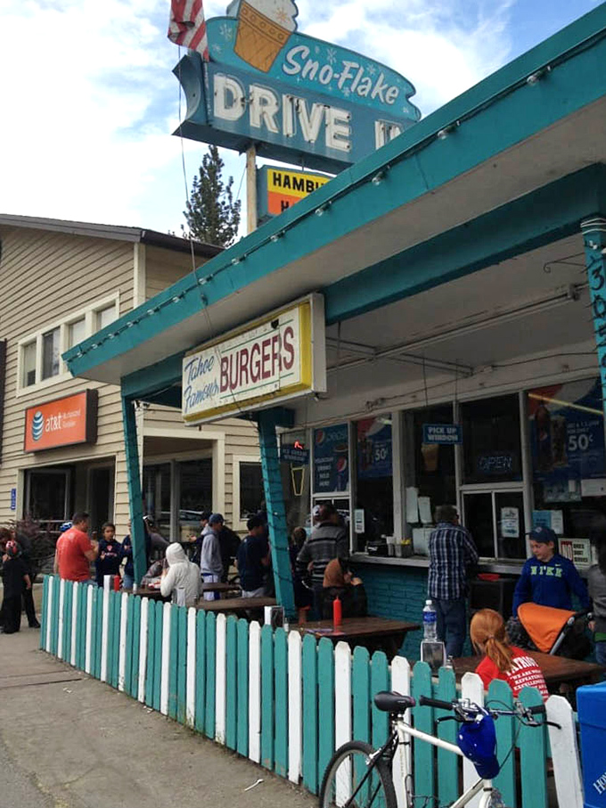 The turquoise fence and vintage signage create the perfect backdrop for burger bliss. On busy days, the line of hungry patrons stretches down the block.