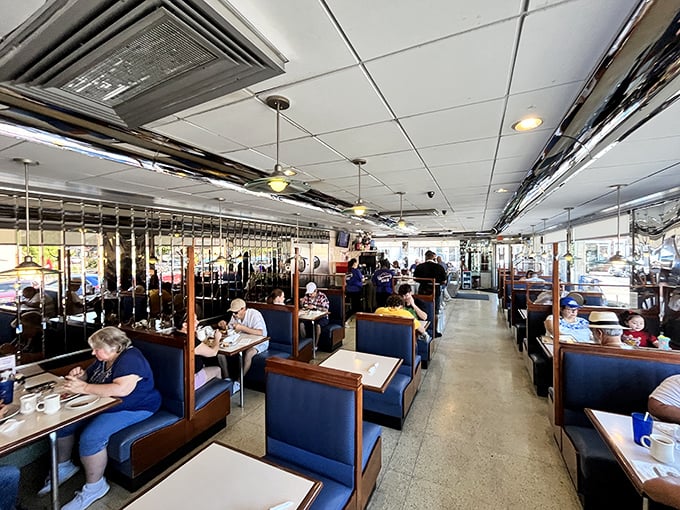 A bustling dining room where strangers become neighbors over coffee refills. Every booth holds a different story, every plate a different craving.