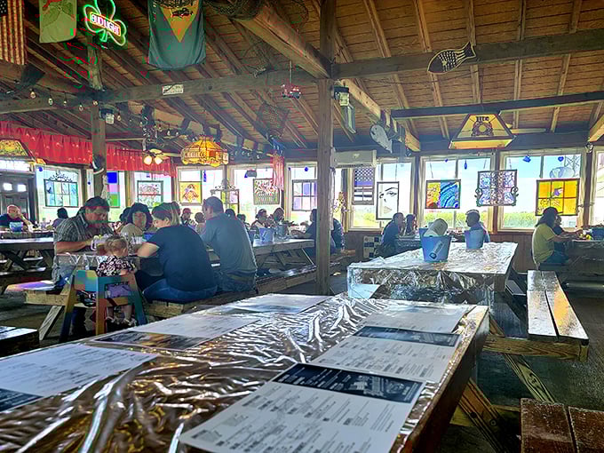 The picnic-style seating area where strangers become friends over shared love of seafood. Notice the plastic tablecloths&mdash;things are about to get deliciously messy.