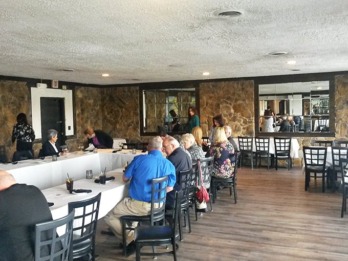 The dining room hums with conversation and clinking glasses – proof that breaking bread together still trumps scrolling through phones.