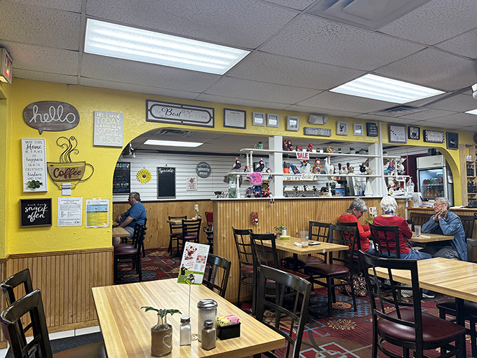 Yellow walls adorned with breakfast wisdom create the perfect backdrop for morning conversations and coffee contemplation.