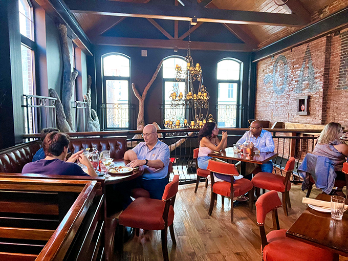 Where memories are made between bites. The dining room's warm wood and natural light invite lingering conversations over exceptional meals.