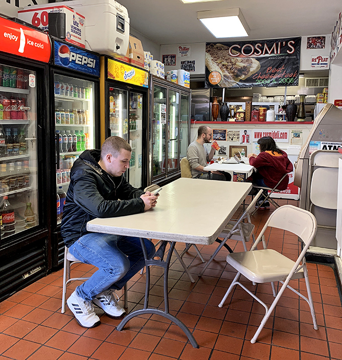 Fellow pilgrims on the sandwich journey, momentarily united in the pursuit of hoagie happiness at this South Philly institution.