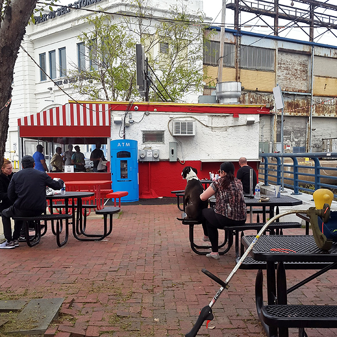 Where sandwich enthusiasts gather like members of a delicious secret society. The red tables say, "Stay awhile, there's more to try."