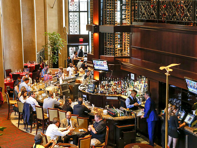 The circular bar buzzes with energy as deals are made and friendships forged. Where Wall Street meets Cheers, with better lighting.