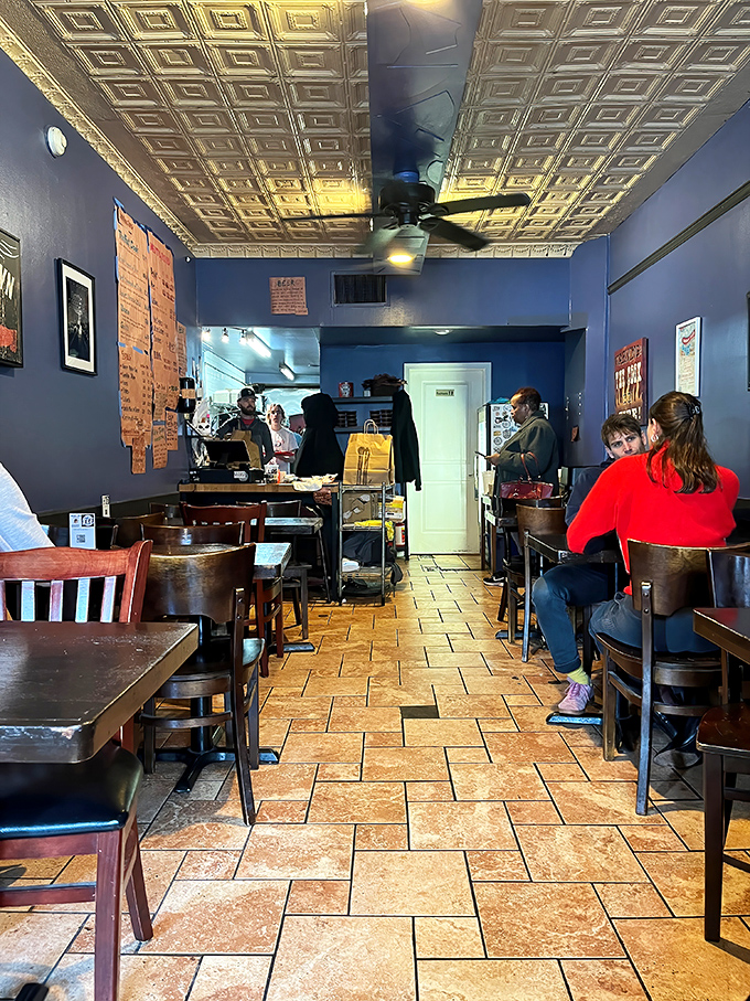 Where barbecue pilgrims gather under vintage tin ceilings, patiently waiting for their moment of smoked meat transcendence.