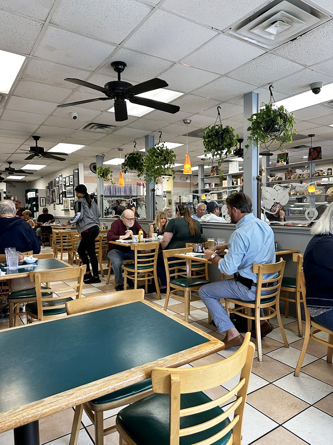Hanging plants and happy diners create the quintessential deli atmosphere&mdash;where breakfast isn't just a meal, it's a community event.