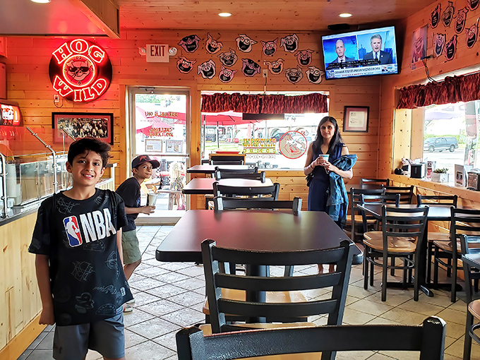 Families gathering around tables at Hog Wild create memories seasoned with sauce and smoke. These moments of shared barbecue joy become the stories we tell for years.