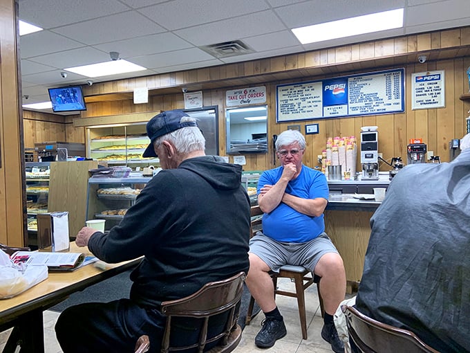 The morning regulars' club in session. Membership requirements: appreciation for donuts and good conversation.
