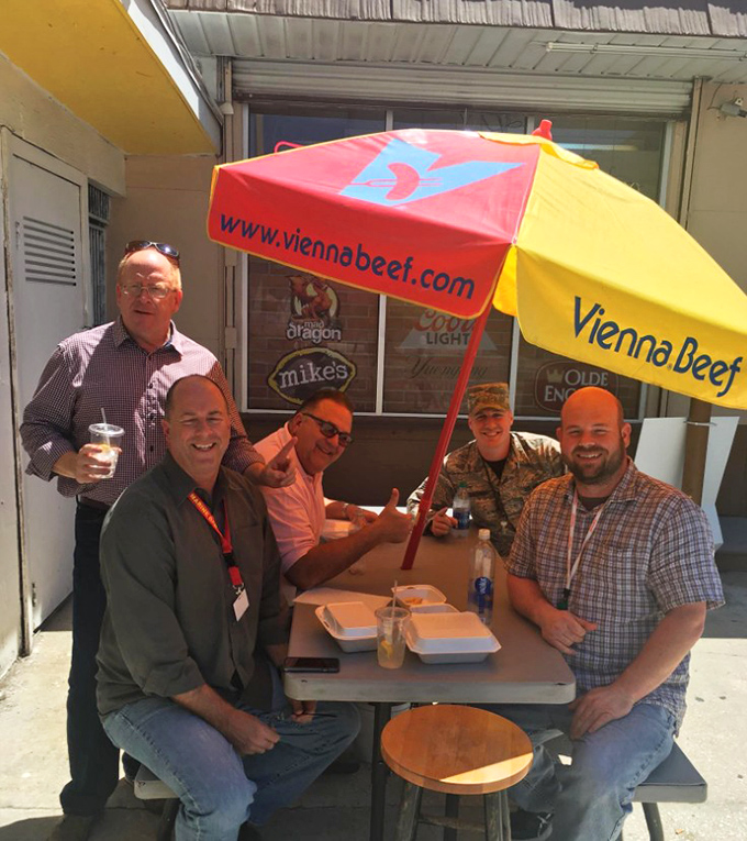 Happy diners enjoying the kind of authentic flavors that make you want to high-five a stranger.