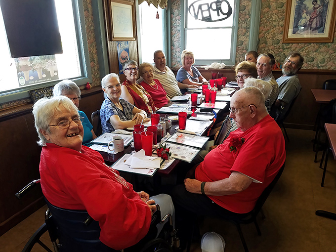 Happy diners in their natural habitat - surrounded by comfort food and good conversation.
