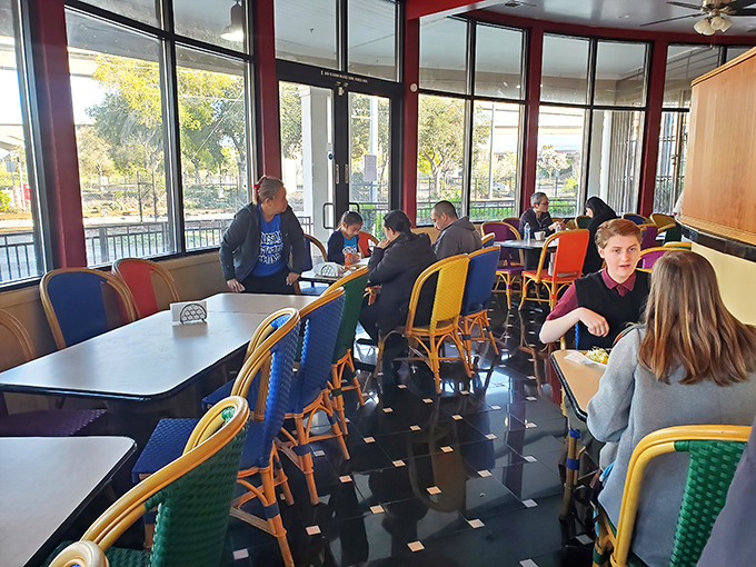 Where strangers become friends over shared plates and new flavors. The colorful chairs seem to know they're part of something special.