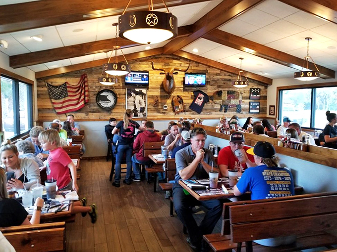 A packed house of BBQ pilgrims enjoying the fruits of low-and-slow cooking. Notice nobody's looking at their phones&mdash;meat commands full attention here.