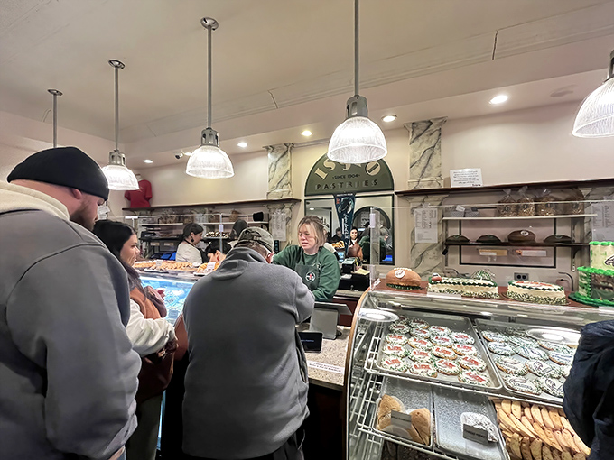 The sacred queue: Philadelphians patiently waiting their turn, united in pursuit of that sweet white box tied with string.