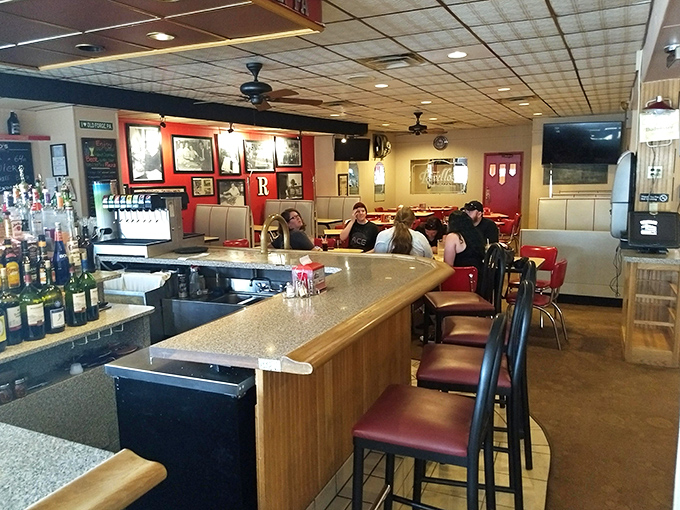 The bar area buzzes with locals and visitors alike, all united in the pursuit of Old Forge's famous rectangular delights and cold beverages.