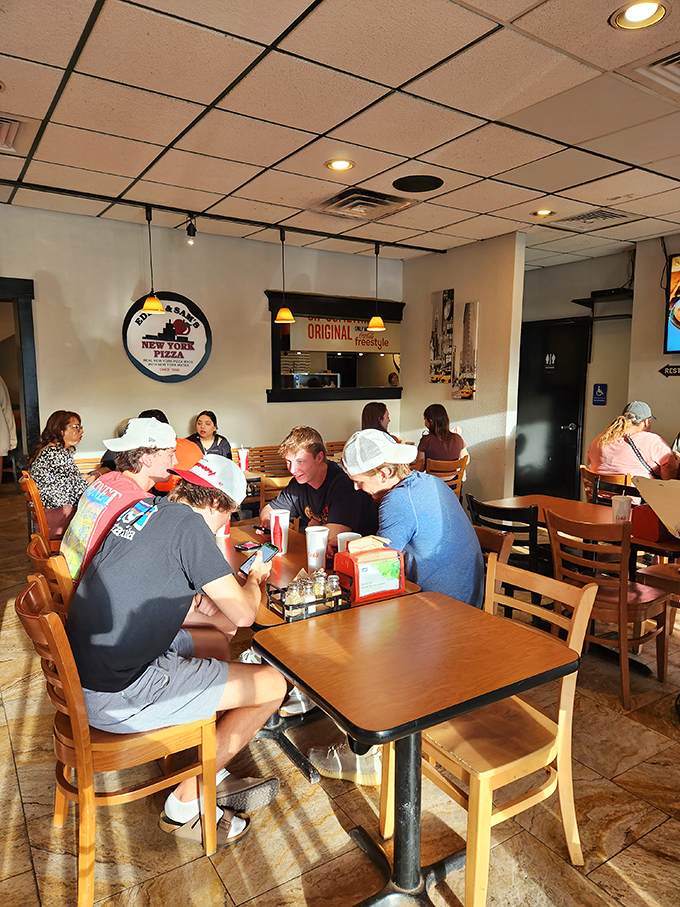 Where strangers become friends over the universal language of exceptional pizza. Notice nobody's looking at their phones&mdash;the food demands attention.