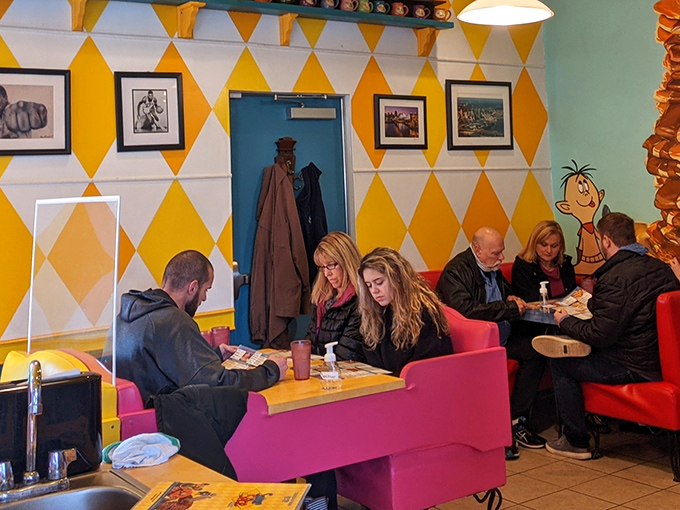 Happy diners prove that good food creates instant community, one pancake at a time.