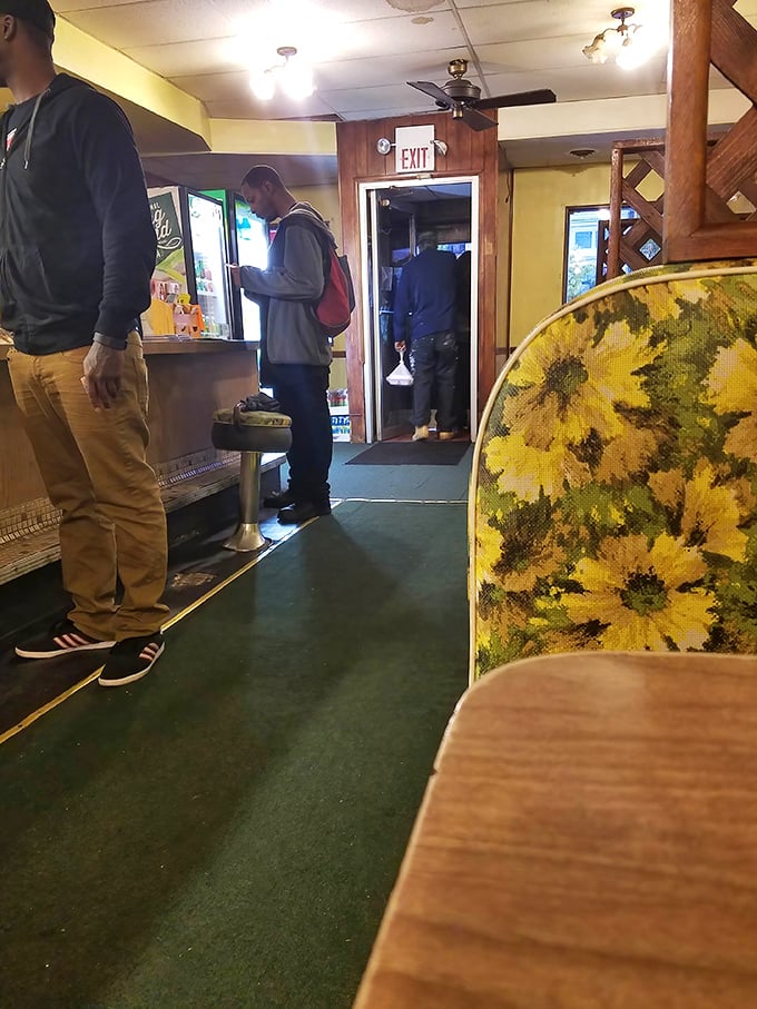 Customers patiently waiting for their orders, already knowing that island time means food worth every minute of anticipation.