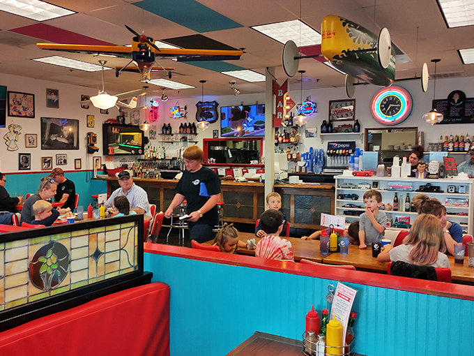 Where families gather around condiment caddies and the buzz of conversation competes with the sizzle from the grill.