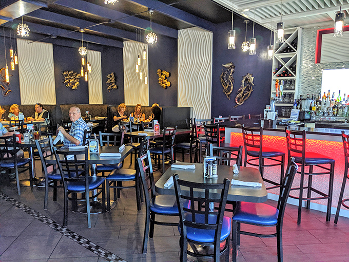 Where locals gather to debate important issues like "which seafood dish to order next" while bathed in the glow of coastal ambiance.