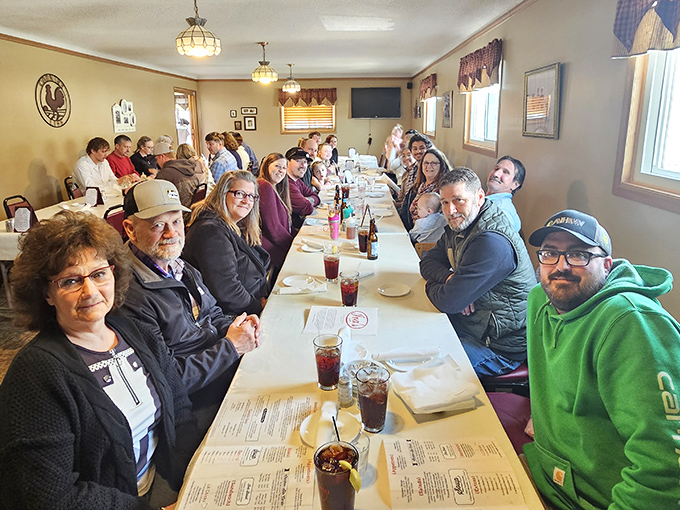 Multi-generational gatherings around these tables aren't just meals&mdash;they're memory factories. The smiles suggest the chicken has worked its magic once again.