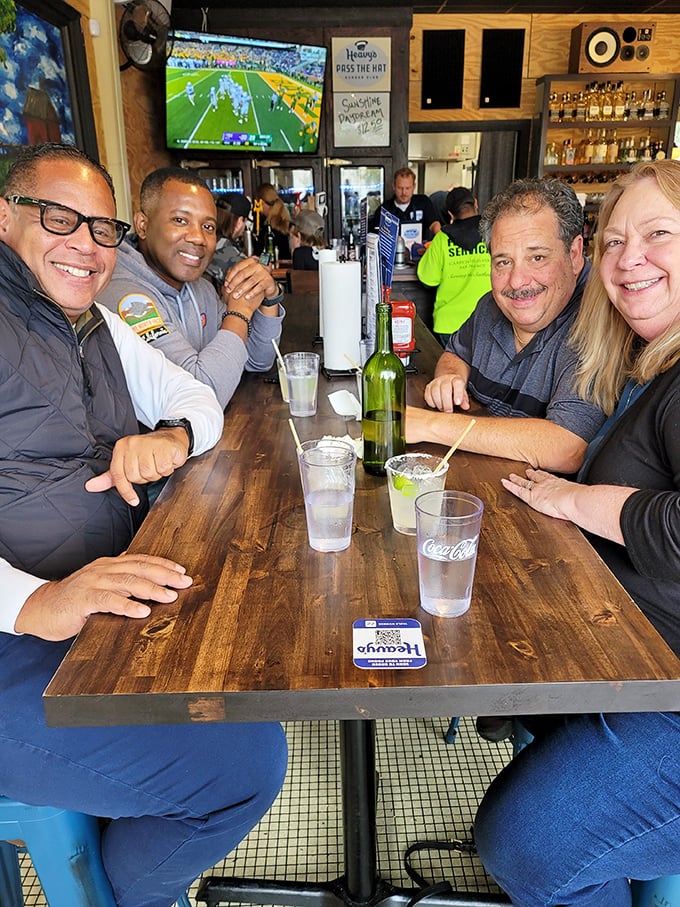 The true measure of a great restaurant: happy faces around the table. Game on TV, drinks in hand, burgers in belly.