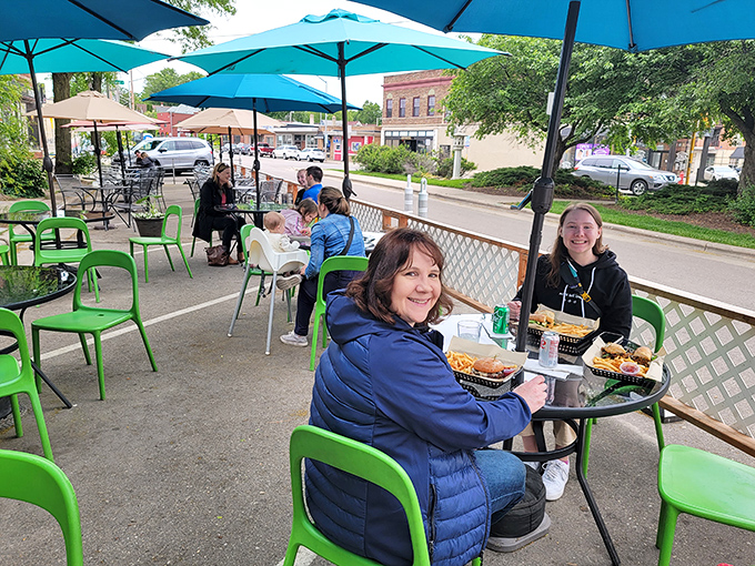 The outdoor dining area buzzes with happy diners enjoying that magical combination of good food and fresh Wisconsin air.