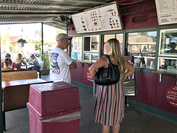 The universal language of anticipation&mdash;hungry customers plotting their order strategy like generals before battle.
