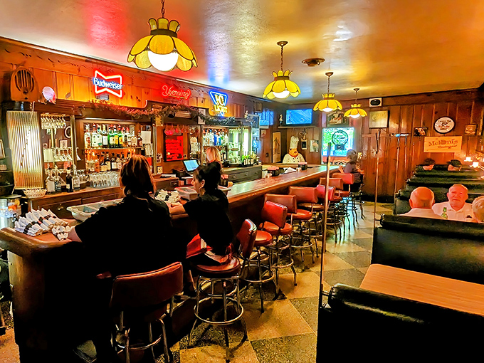 The bar area buzzes with the energy of regulars who've been claiming the same stools since before smartphones ruined dinner conversation.