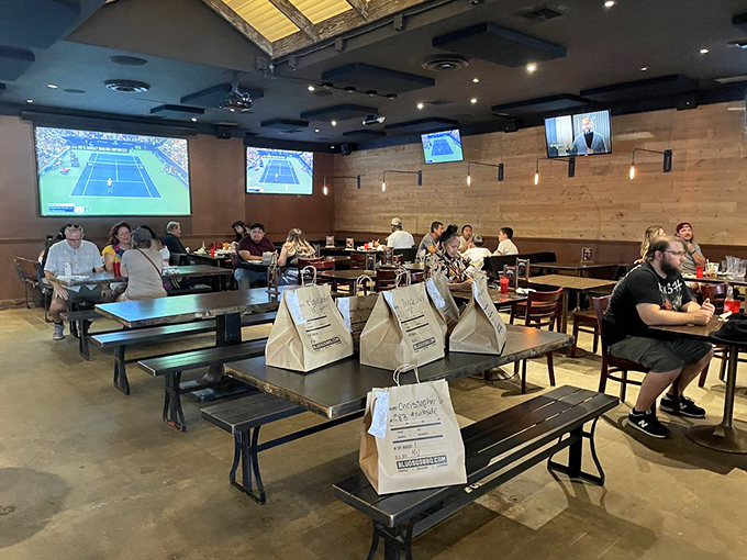 Sports on the screens, barbecue on the tables, and paper bags ready for takeout&mdash;this is the modern barbecue joint in its natural habitat.