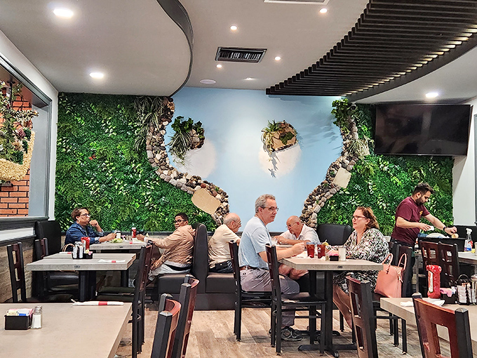 The living wall brings the outdoors inside, creating a garden-fresh backdrop for the serious business of enjoying a proper diner breakfast.