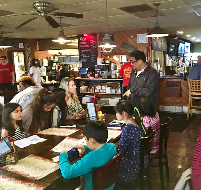 Multi-generational dining at its finest - where grandparents and grandkids bond over exceptional seafood and shared smiles.