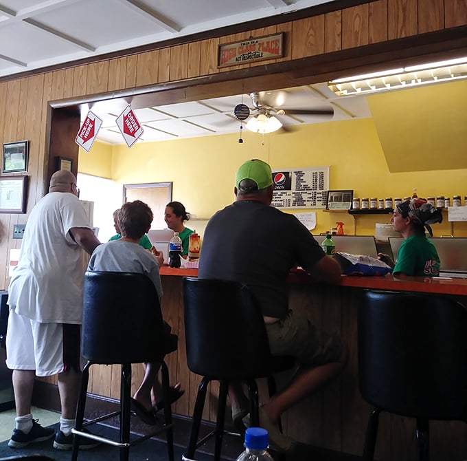 The counter where magic happens—where orders are placed and anticipation builds. These customers know they're minutes away from satisfaction.