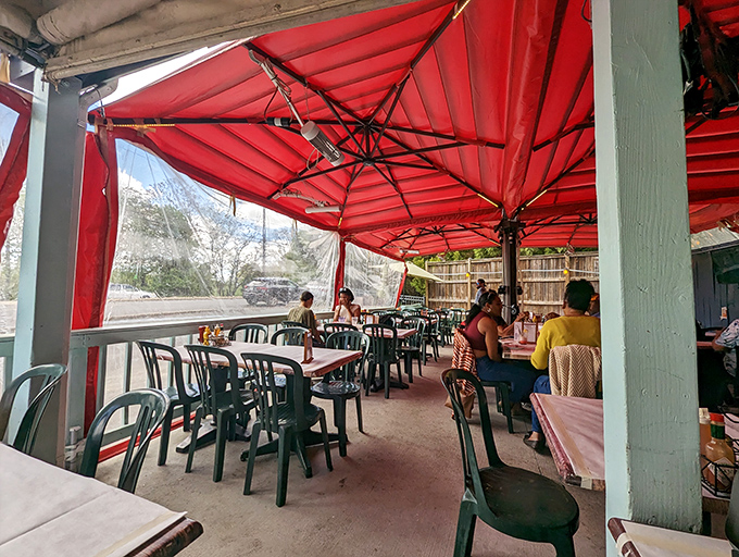 The covered patio offers al fresco dining under cheerful red umbrellas. Even Mother Nature wants you to enjoy those crab cakes in comfort.