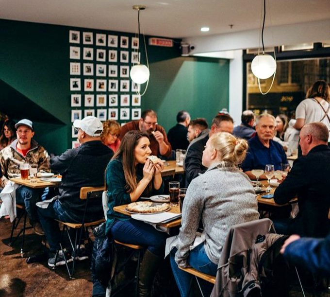 The universal expression of pizza joy&mdash;that moment when the first bite exceeds all expectations and conversation momentarily ceases.