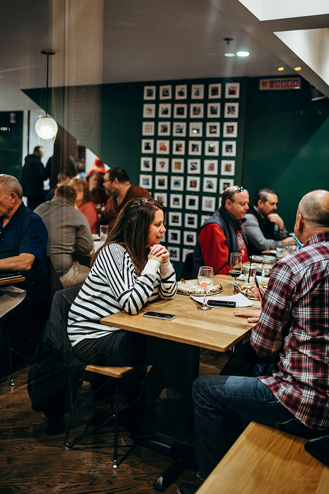 The universal language of good food bringing people together&mdash;notice nobody's looking at their phones? That's the Wooden Paddle effect.
