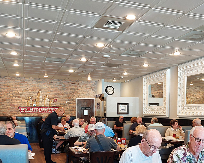 A dining room filled with regulars who know the secret to happiness involves bagels and schmear. The collective wisdom in this room is immeasurable.