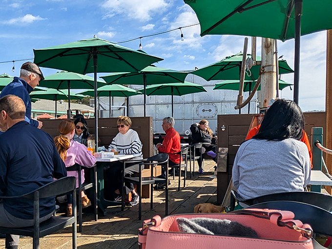 The outdoor patio&mdash;where strangers become friends over shared tables and the unspoken agreement that life is simply better with ocean views and good food.