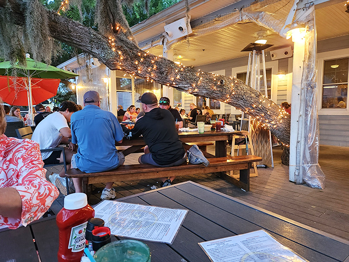 Dining under ancient oaks strung with twinkling lights &ndash; Mother Nature's way of saying "this meal deserves a special setting."