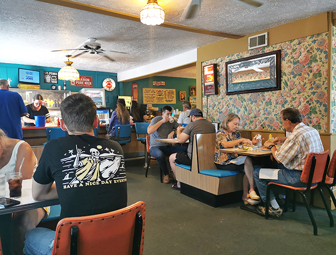 The universal language of diner fellowship – strangers connected by blue vinyl seats and the pursuit of perfect eggs.