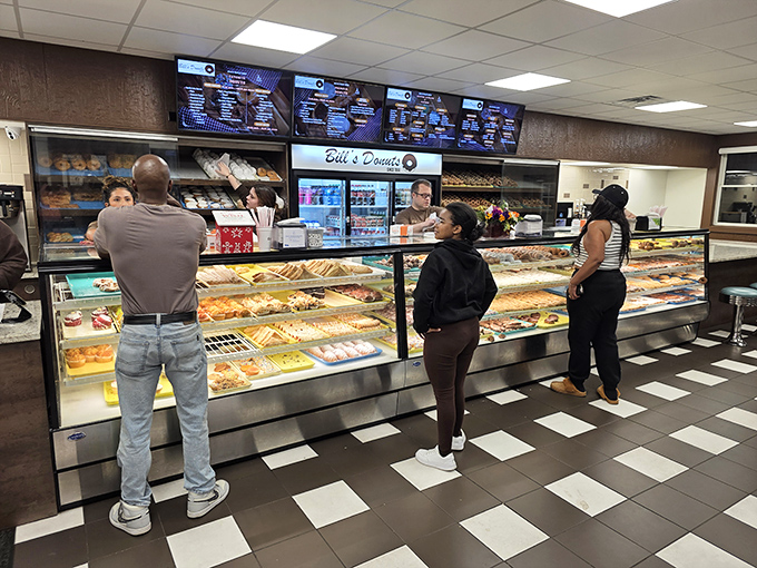 The display case beckons like a siren song, with locals wisely heeding its call for glazed, frosted, and filled treasures.